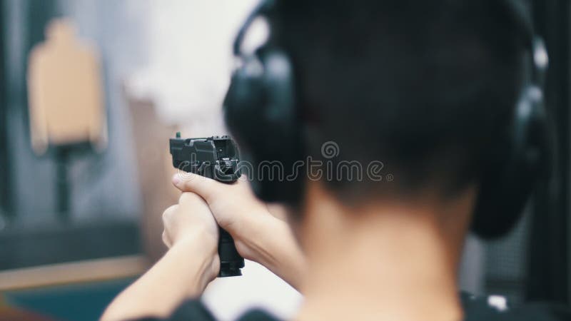 Shooting Gallery. a Young Man Aiming in a Target Using a Gun Stock ...