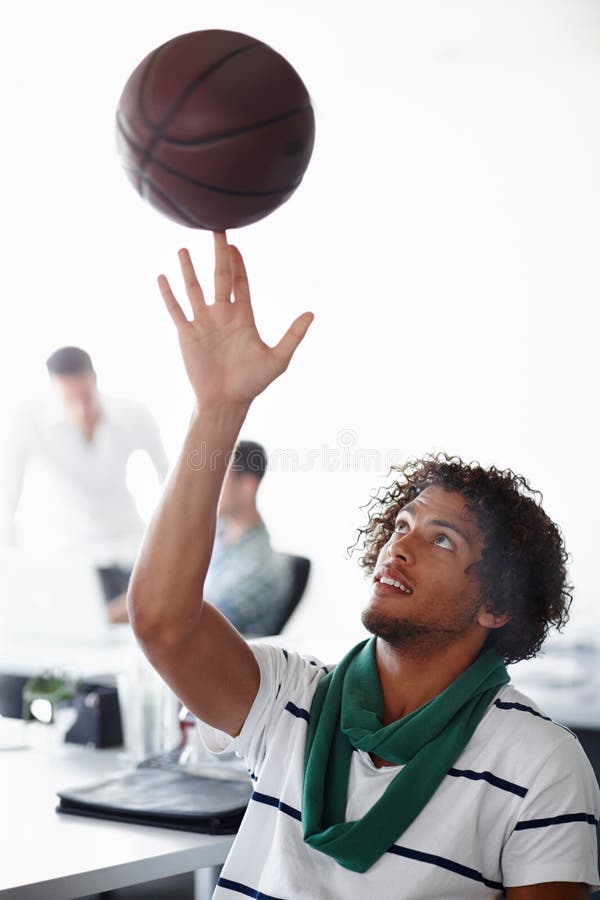 Shooting Hoops after Work. a Young Man Playing with a Basketball while ...
