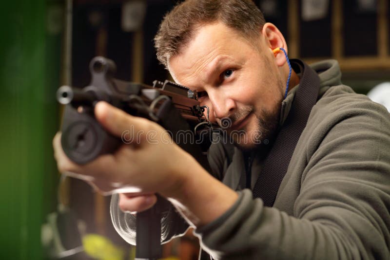 Shooting, a Man in Shooting Stock Image - Image of shield, rear: 80072653