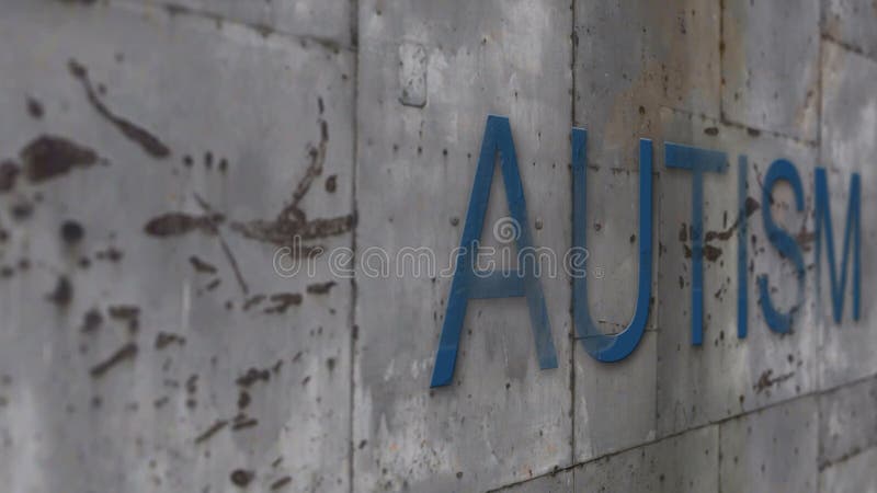 Shooting Metal Wall with Word Autism Stock Video - Video of background ...