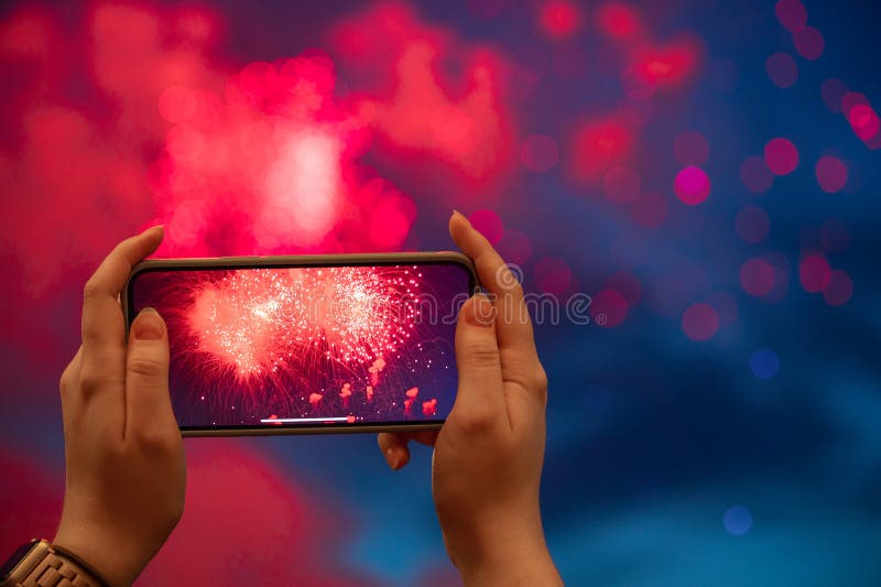Shooting Night Fireworks on a Smartphone, Hands Make a Photo of a ...