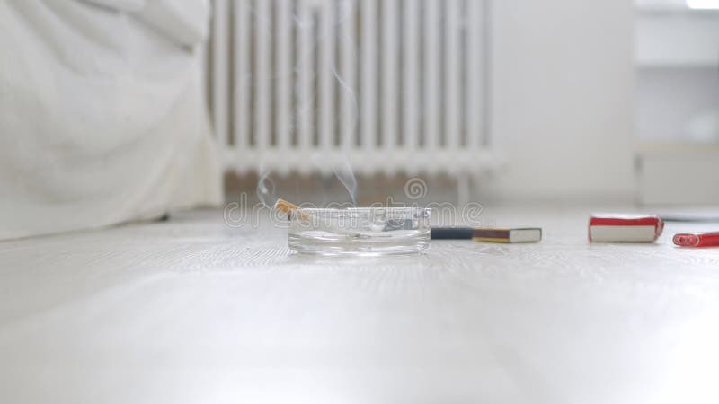 Shooting with a Person Sitting in the Bedroom, Smoking a Cigarette, and ...