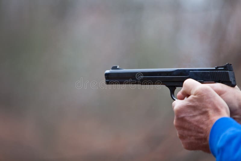 Shooting a Pistol stock image. Image of hunter, firearm - 11956347