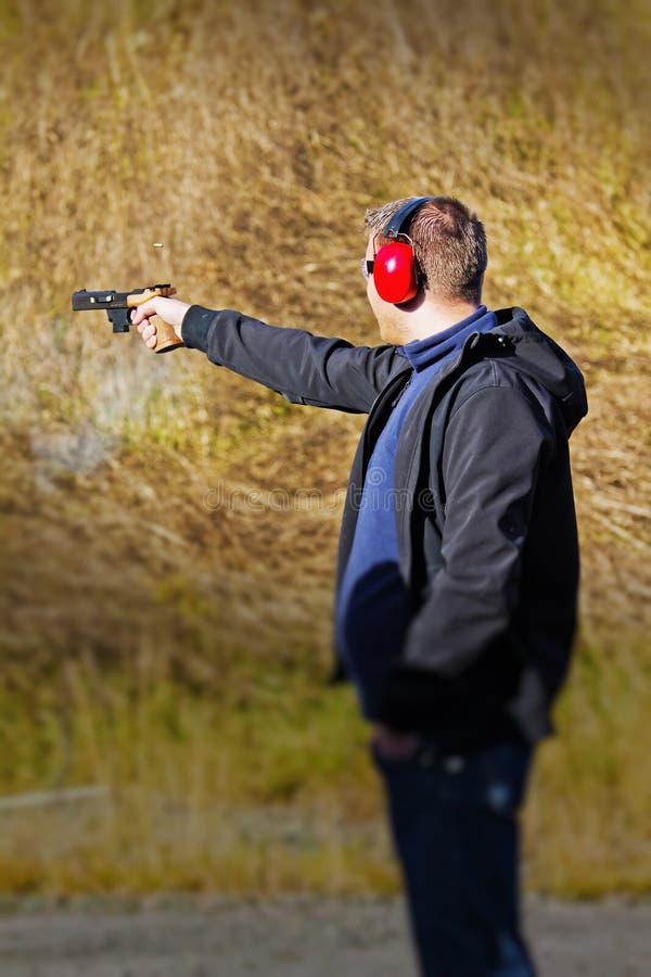 Man Shooting Rifle stock photo. Image of optic, sport - 13060052