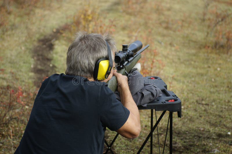 Shooting a Scoped Rifle stock photo. Image of rifle - 133312200