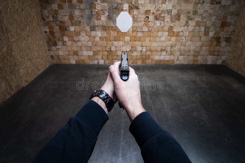 Shooting at a Shooting Range, a Firearm in a Man S Hands Aiming at a ...