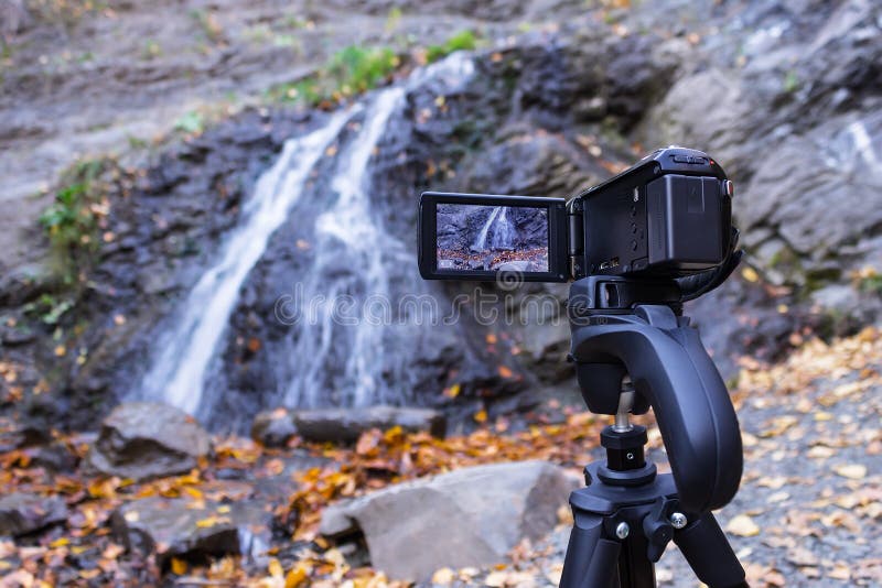 Shooting a Waterfall on a Video Camera with a Tripod Stock Image ...