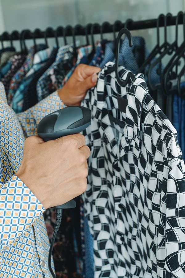 Shop Assistant in a Clothes Shop Using a Barcode Scanner Stock Photo ...