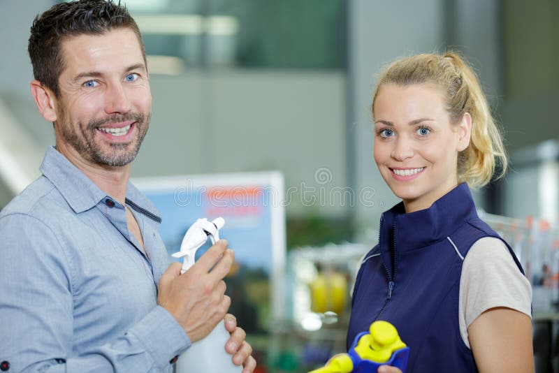 Shop Assistant and Customer Looking at Camera Stock Photo - Image of ...