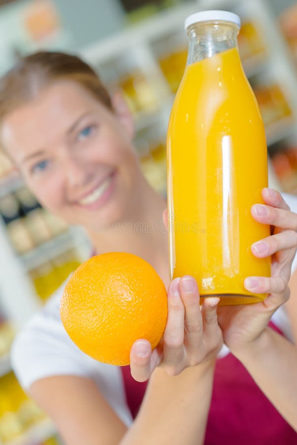 Shop Assistant Holding Orange and Juice Stock Image - Image of natural ...
