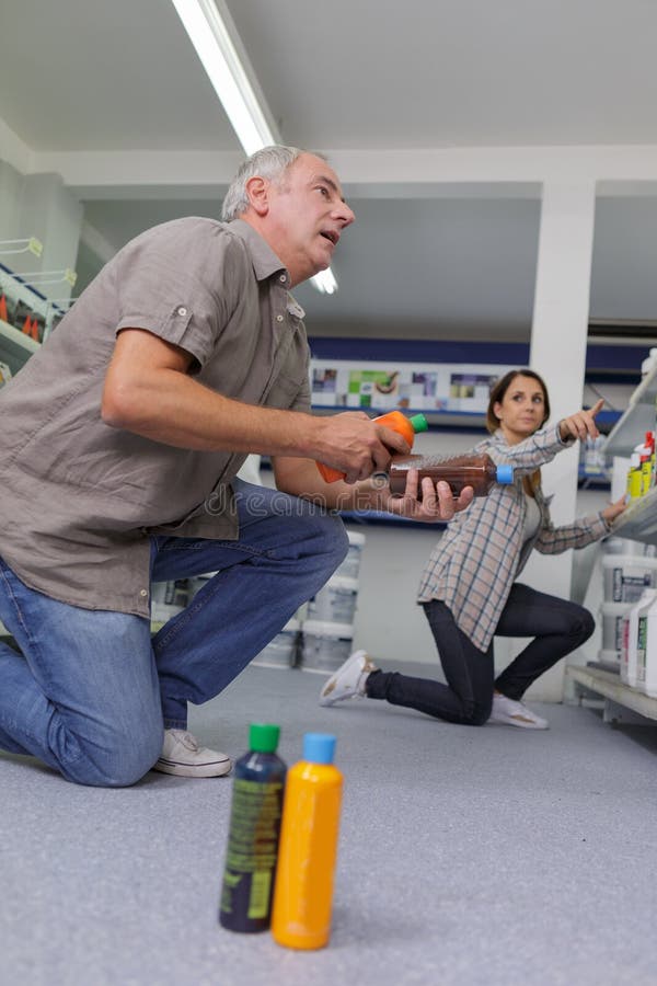 Shop Assistant Showing Customer Where To Find Product Stock Image ...