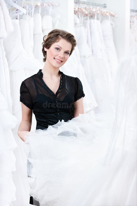 Shop Assistant Try To Select a Proper Dress Stock Photo - Image of ...