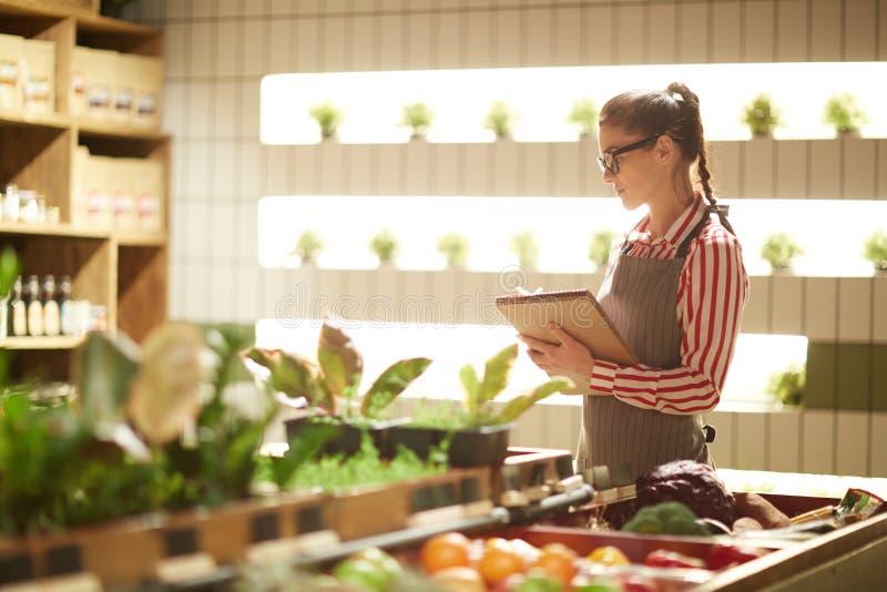 Woman In Supermarket And Shop Assistant Stock Photo - Image of cart ...
