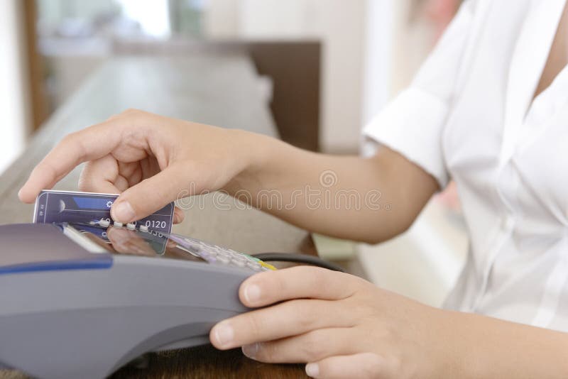 Shop Attendant Sweeping Credit Card at Store Counter Stock Image ...