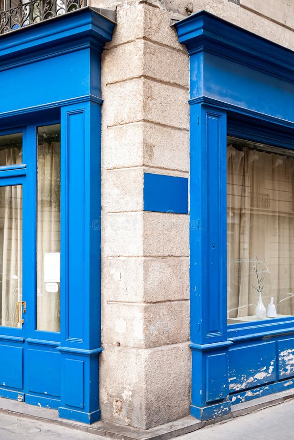 Blue Street Corner with Stone Wall and Storefront in Paris, France ...