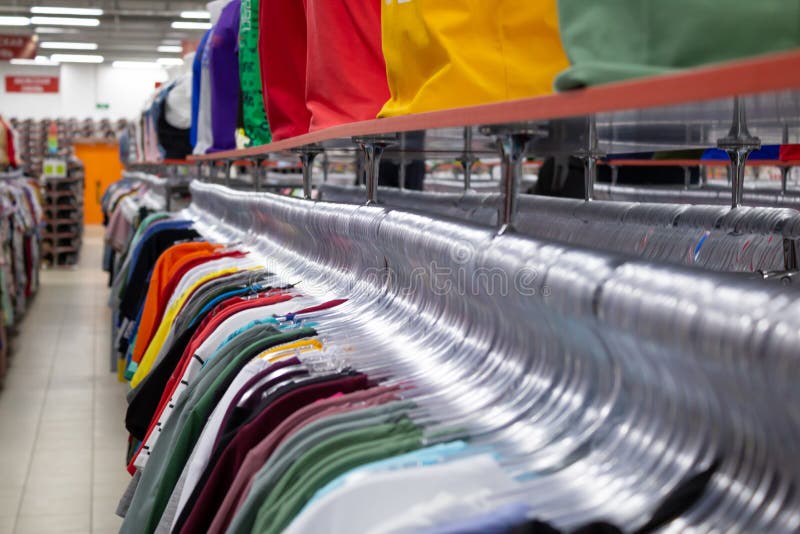 Shop hangers with clothes. stock photo. Image of clothes - 219257920