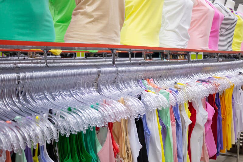 Shop hangers with clothes. stock photo. Image of clothes - 219257920