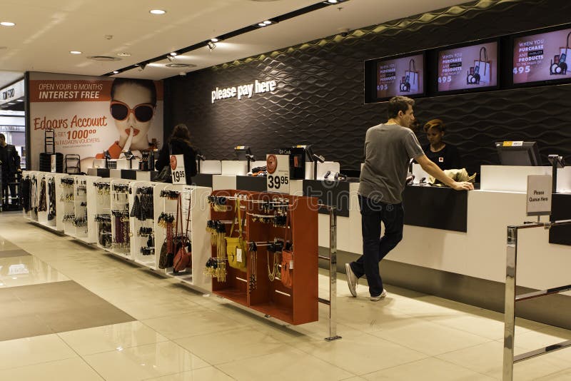 Shop man paying counter editorial photography. Image of merchandise ...