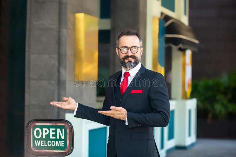 Shop Manger Standing by Open Welcome Signboard in Front of Shop. Stock ...
