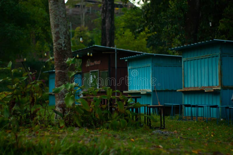Shop stalls lining a park stock image. Image of park - 286593355