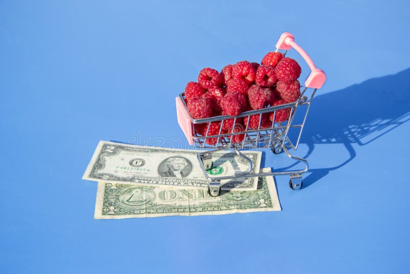 Shop Trolley Full of Ripe Red Raspberries. Under the Wheels of the ...