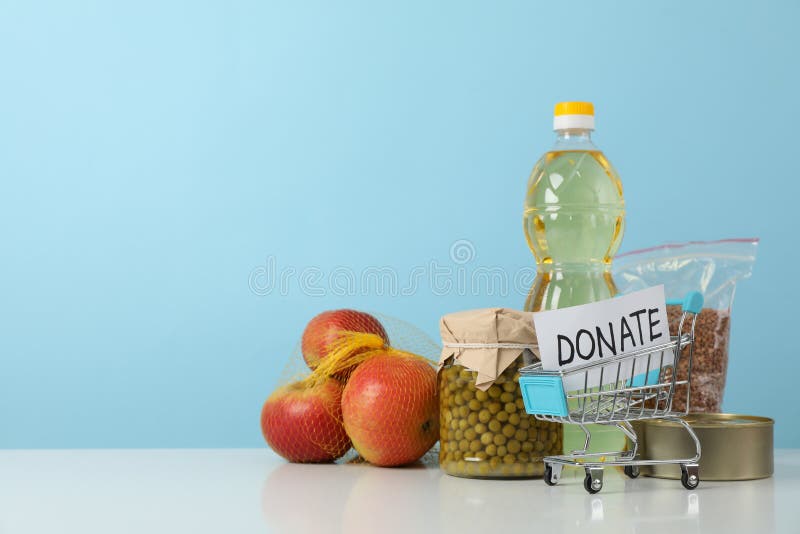 Shop Trolley Text Donate and Different Food Against Blue Background ...