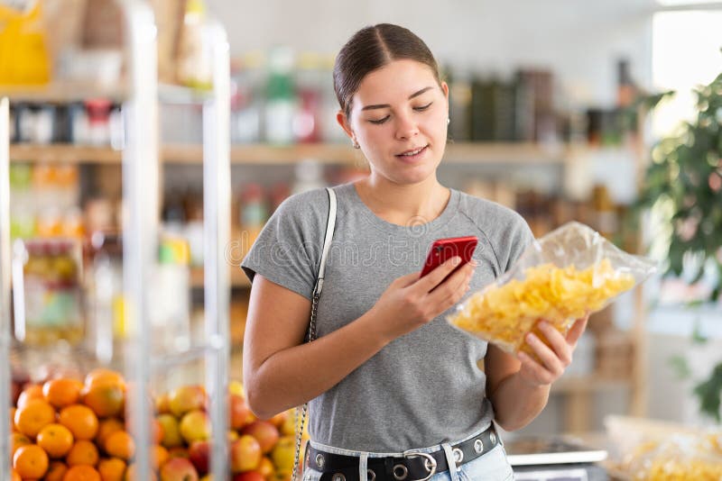 In Shop Youth Girl Scan QR Code and Take Reading Potato Chips Using ...
