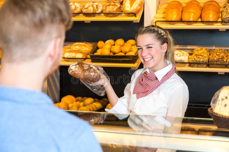 Shopkeeper at Bakery Working at Cash Register Stock Photo - Image of ...