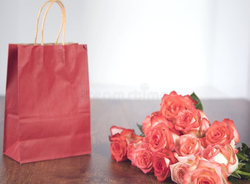 Shopping bag and roses stock image. Image of frame, gift - 184513381