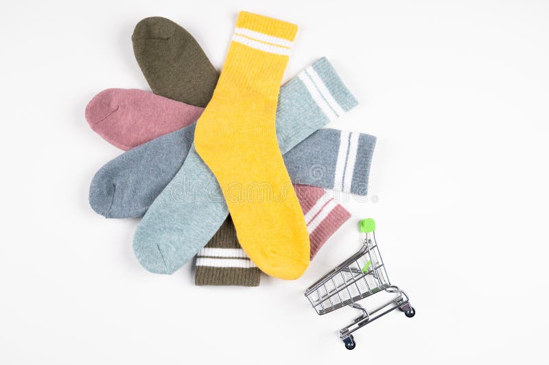 Shopping Cart and a Stack of Multi Colored Socks Isolated on White ...