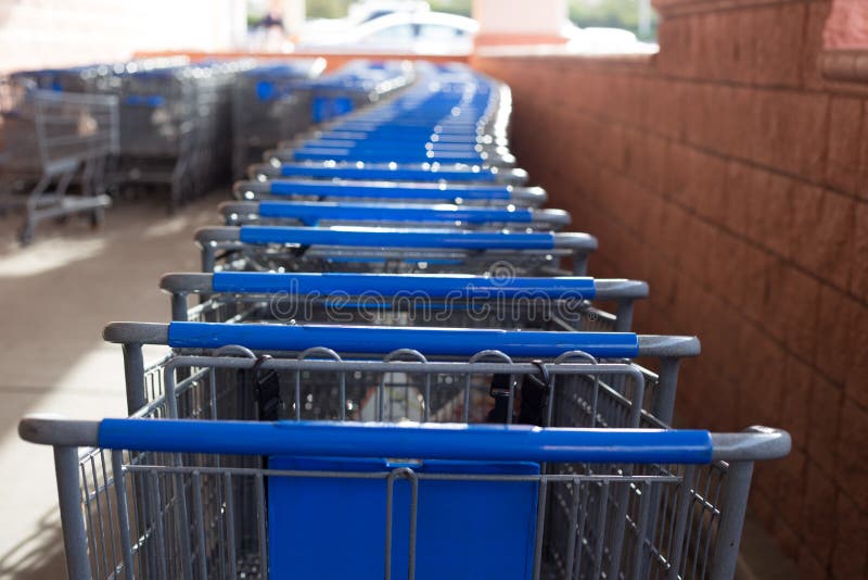 Shopping Carts in a Row stock photo. Image of blue, gray - 33179184