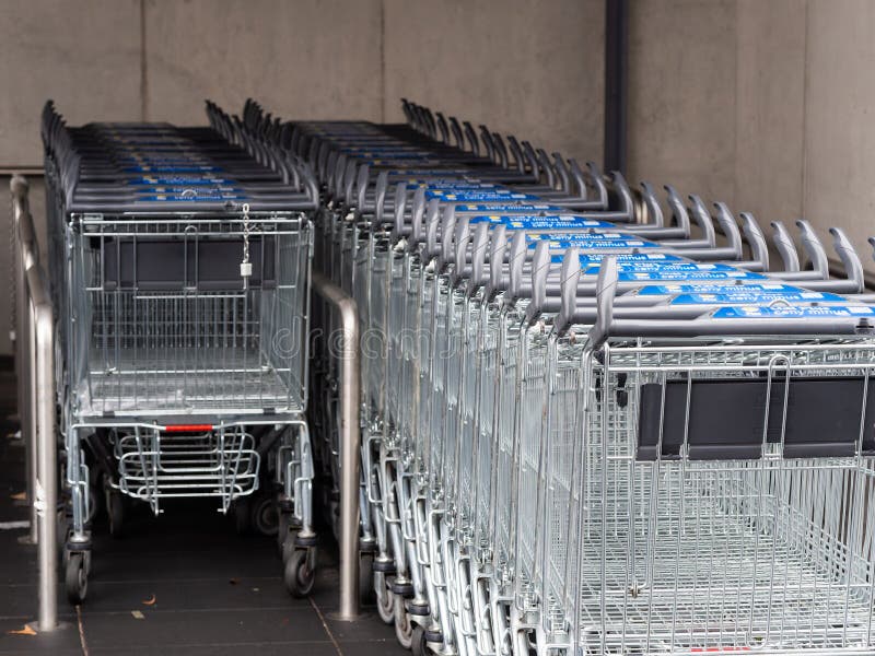 Shopping carts in row stock photo. Image of retail, empty - 237665016
