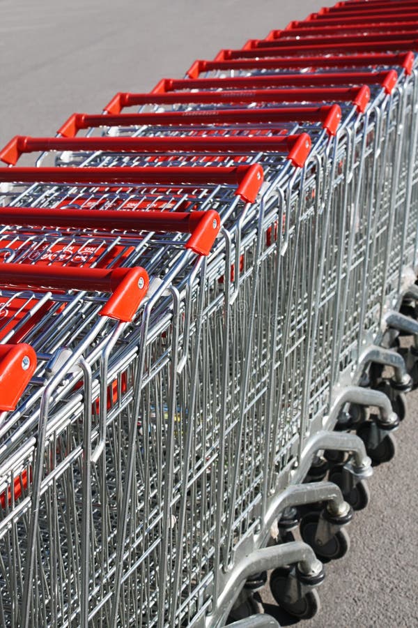 Shopping carts in rows stock image. Image of consumption - 31105341