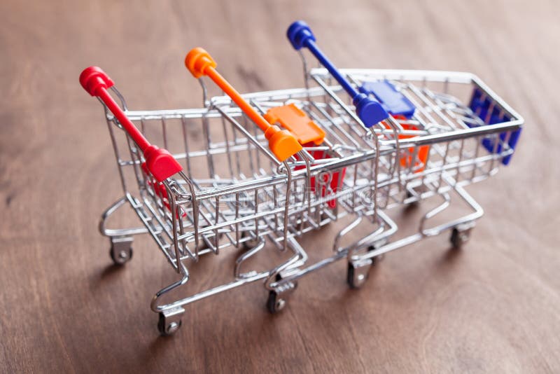 Shopping Carts on Wooden Surface. Stock Photo - Image of groceries ...