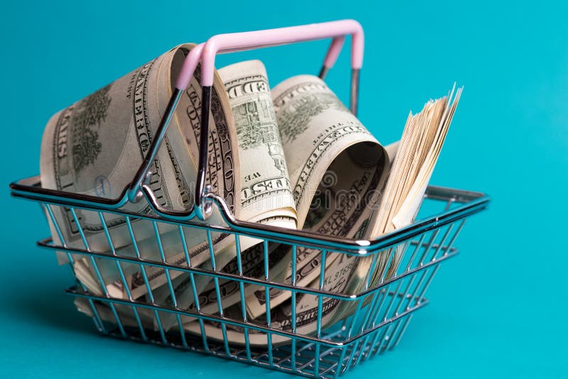 Consumer Basket Value Concept. Girl Weighs Money and a Shopping Basket ...