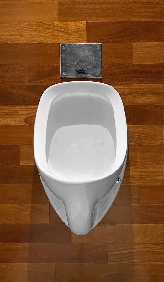 Bathroom with White and Pink Urinal with Presence Sensor Flush Stock ...