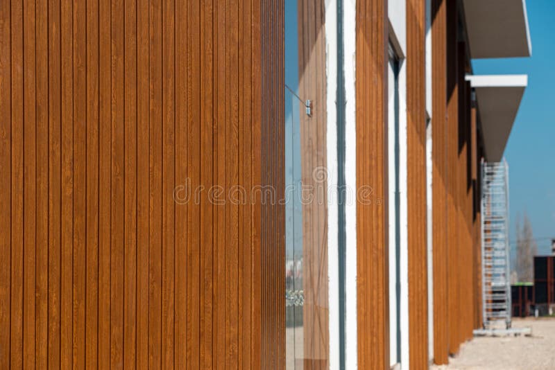 The Shopping Mall with Its Facade Covered with Wood-patterned PVC ...