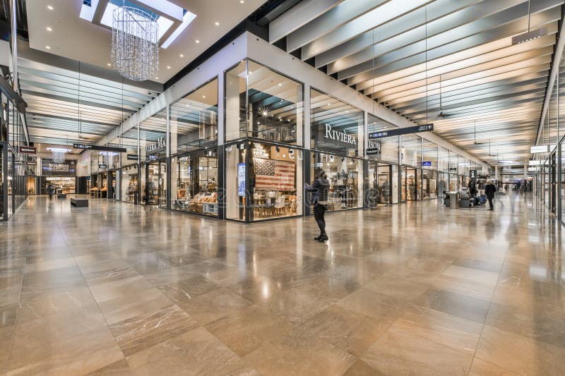 A Shopping Mall with People Walking Around and a Store Editorial ...
