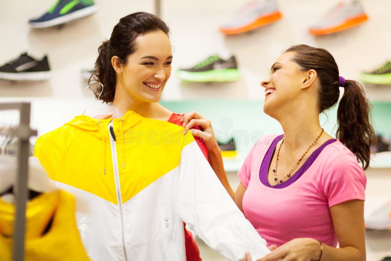 Sportswear shop assistant stock photo. Image of organizing - 26729936