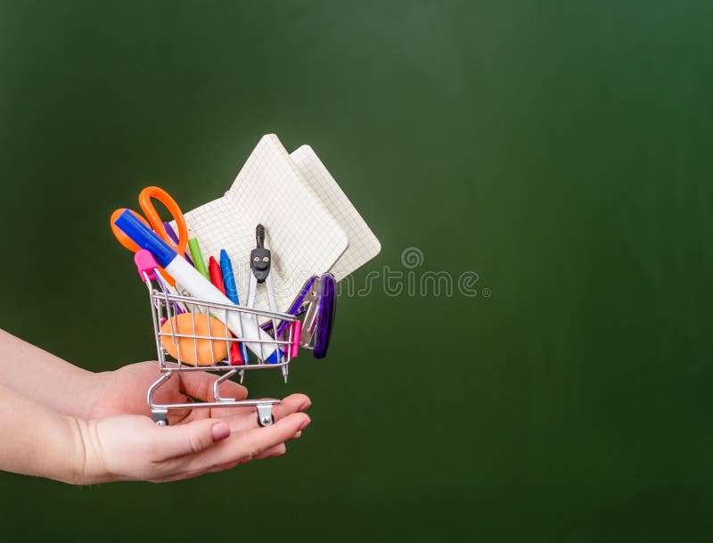 Shopping Trolley on the Hands Near Empty Green Chalkboard Stock Image ...