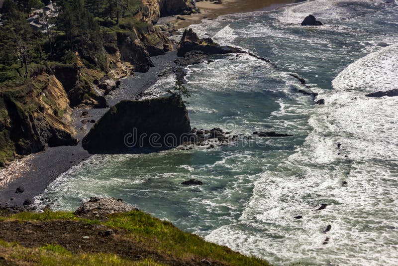 Cliffside View of Ocean Wave Breaking on Rocky Shoreline Stock Photo ...