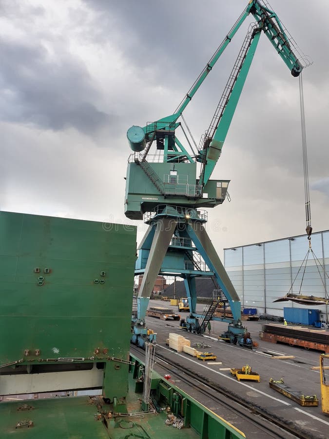 Shore Crane Loading Containers in Freight Ship. Stock Photo - Image of ...