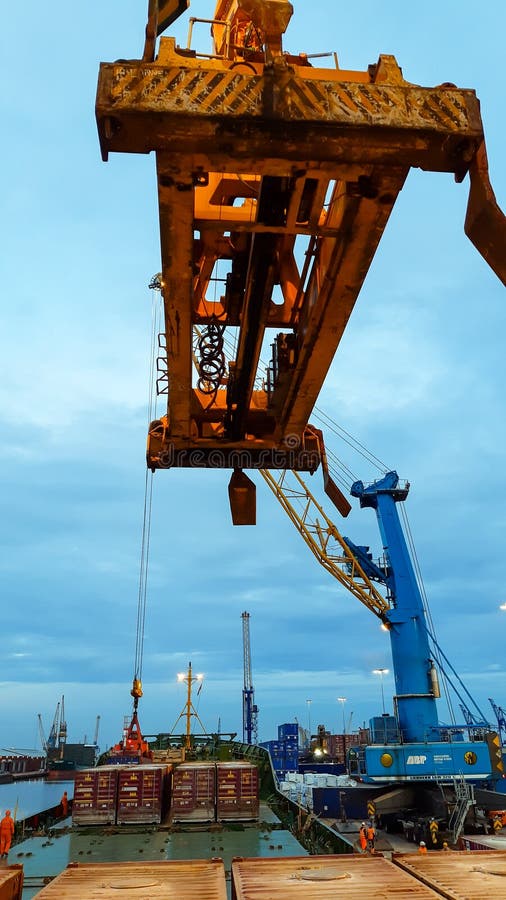 Shore Crane Loading Containers in Freight Ship Editorial Photo - Image ...