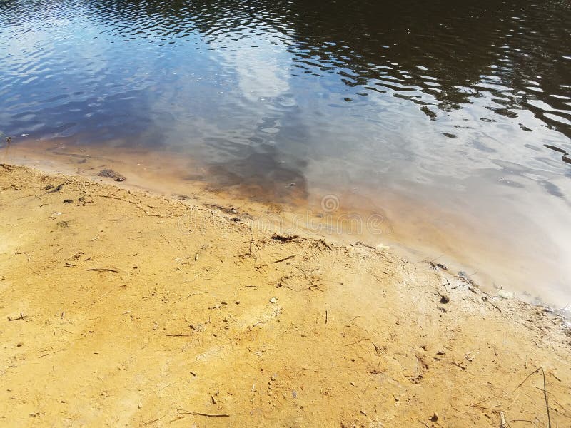Shore of a lake with mud stock photo. Image of reflection - 120973752