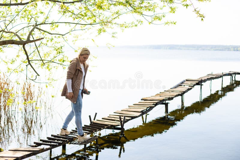 The Shore of the River with Little Bridge Fisherman Stock Photo - Image ...