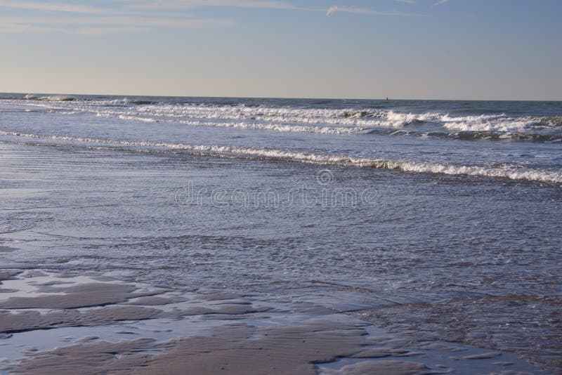 The Shore of the Sea at Low Tide, Visible Sea Waves in the Distance ...