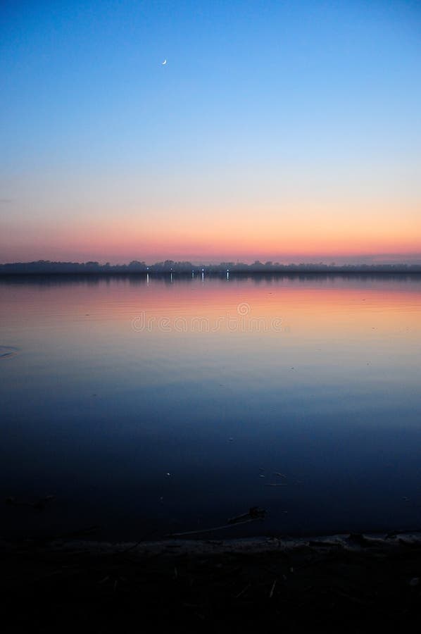 The Shore of a Wide River at Sunset, the Sun Had Already Set, Staining ...