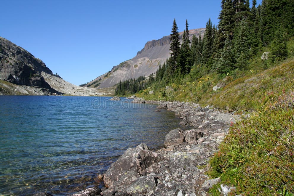 Shoreline of Ring Lake stock photo. Image of remote, rocks - 1269080