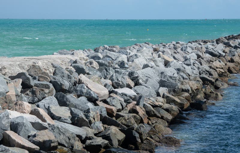 Shores of Miami Beach with Rocks and Boulders Stock Photo - Image of ...