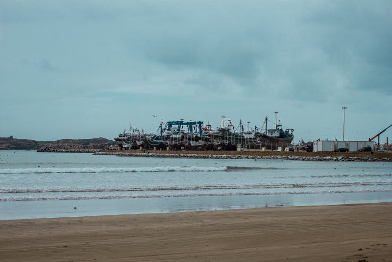 Shoreside View of the Ships Parked in a Harbor on the Coast Under the ...
